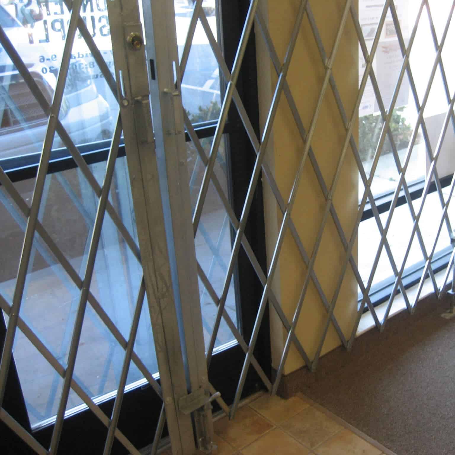 Heavy Duty Pair Folding Security Gates - Barron Equipment & Overhead Doors